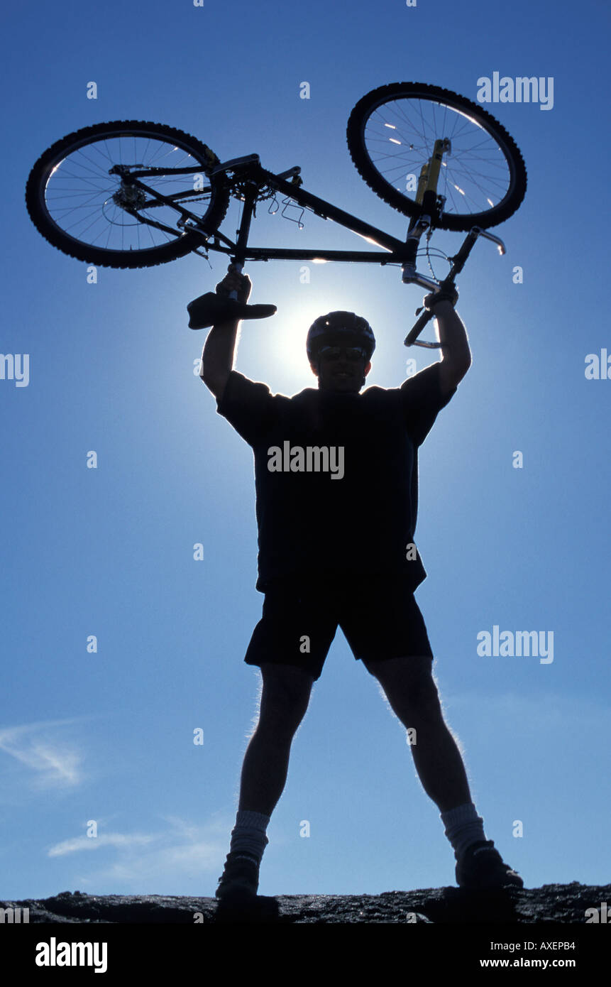 Man Holding Bicycle Over His Head Stock Photo - Alamy