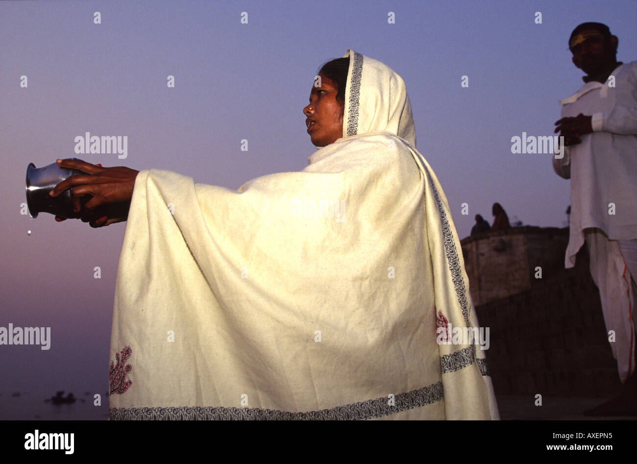 Radha a low caste Hindu priestess worships at the River Ganges in ...