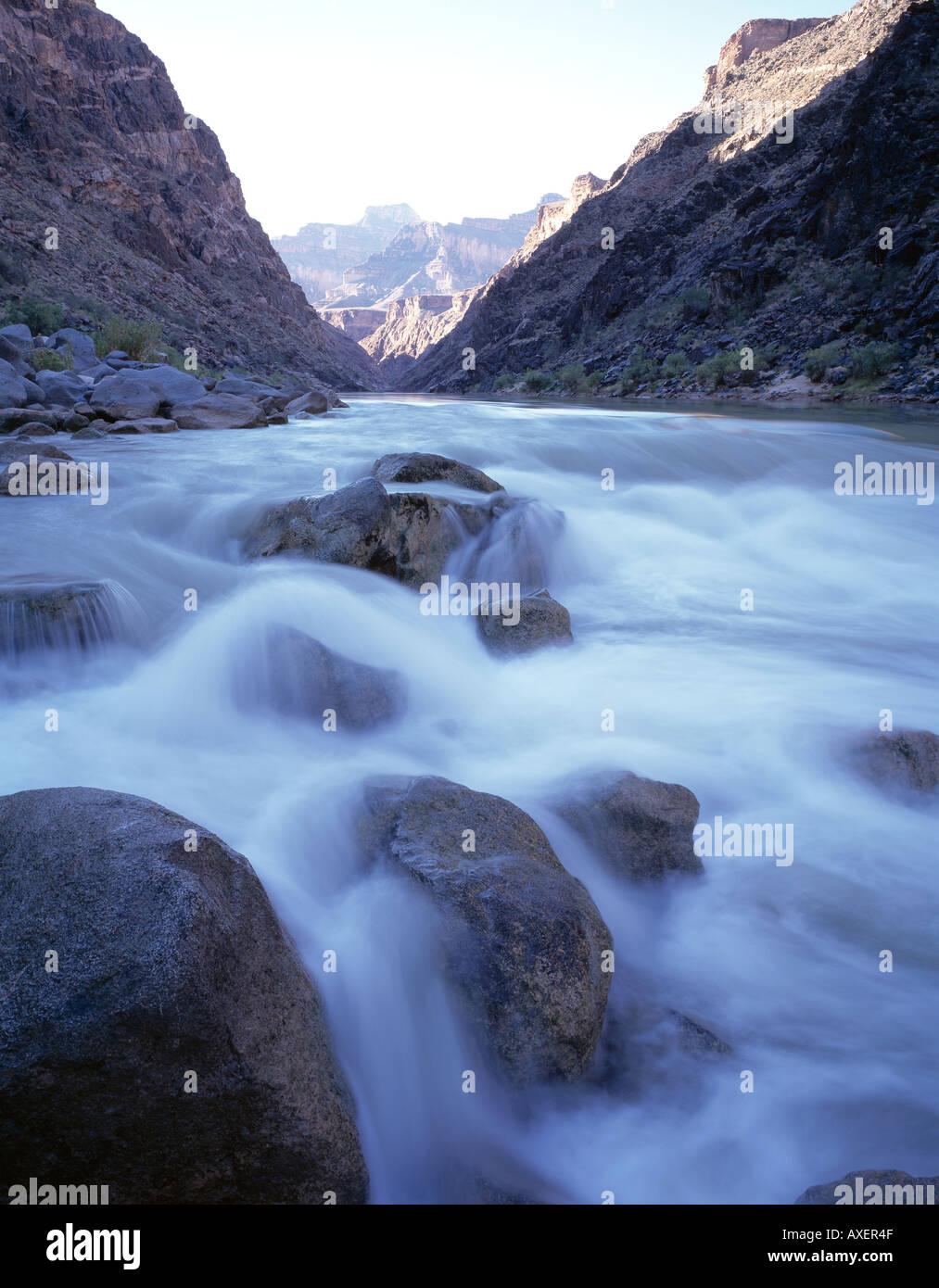 River Flowing Over Rocks in Canyon in Shadow Stock Photo - Alamy