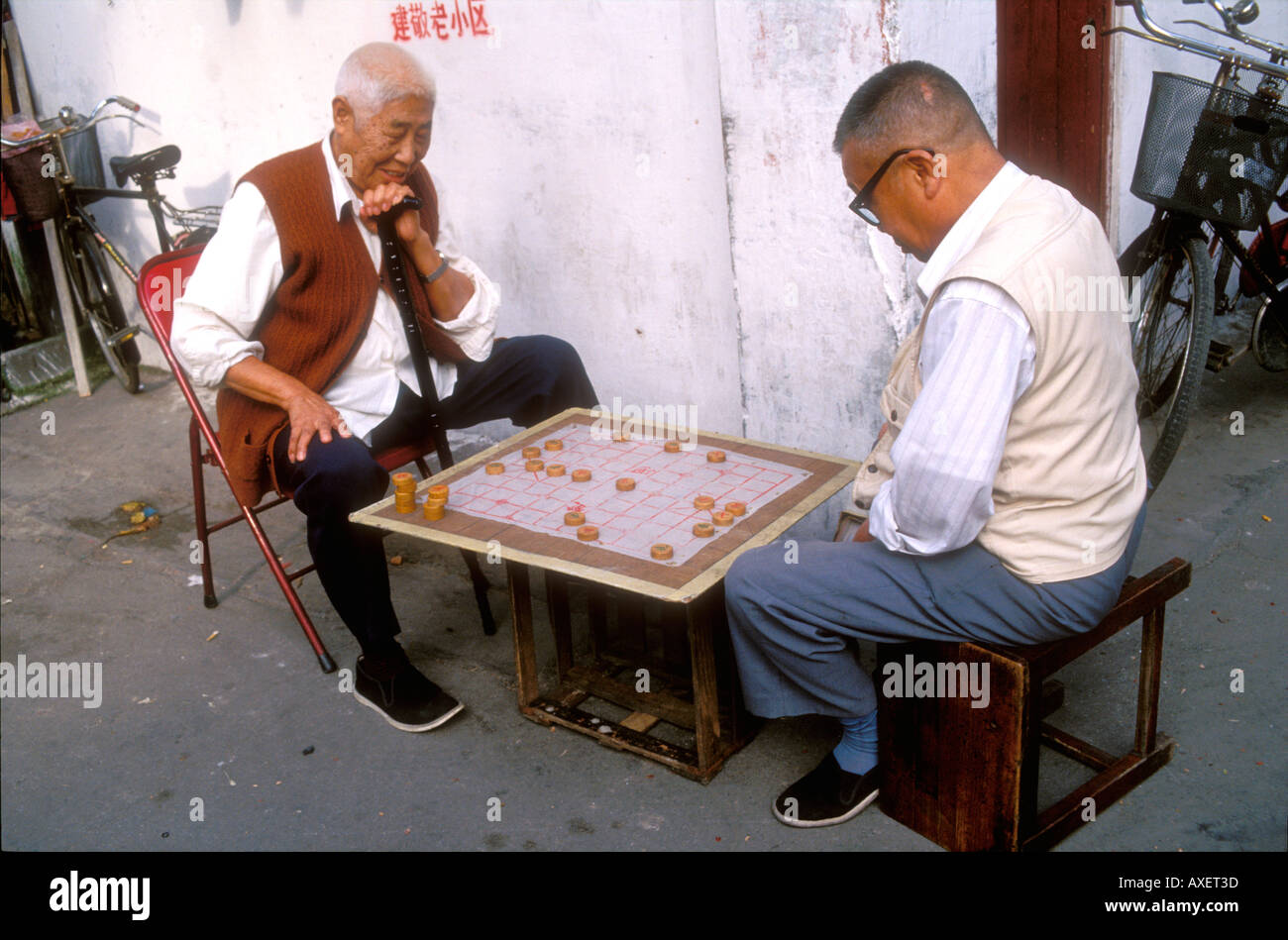 Two chinese men play chinese checkers in street, Shanghai Stock Photo ...