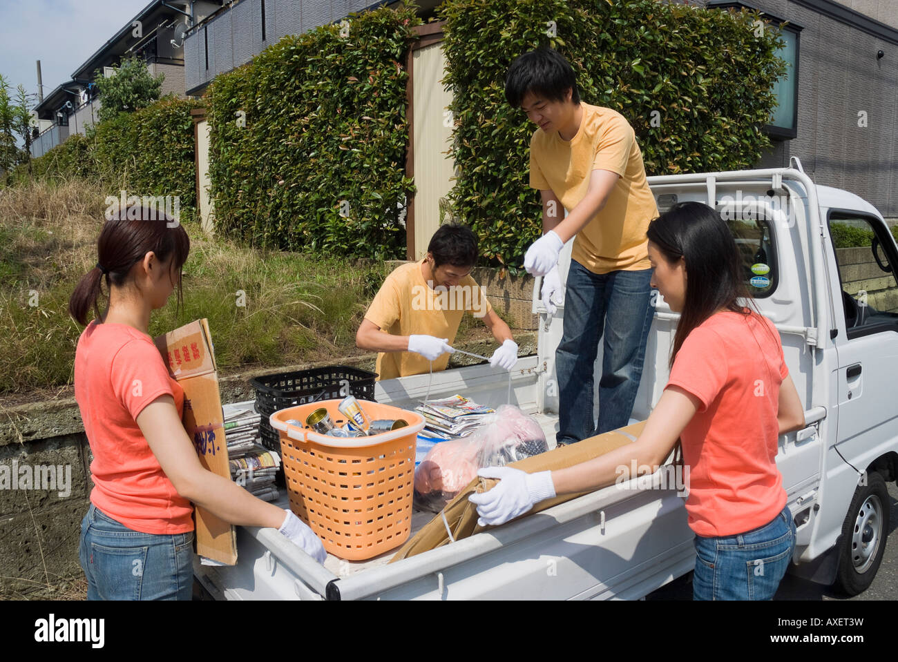 Young people collecting garbage Stock Photo - Alamy
