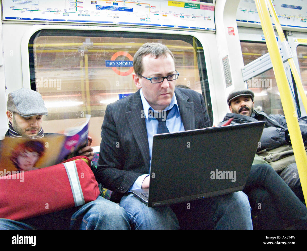 Commuter london tube laptop hi-res stock photography and images - Alamy