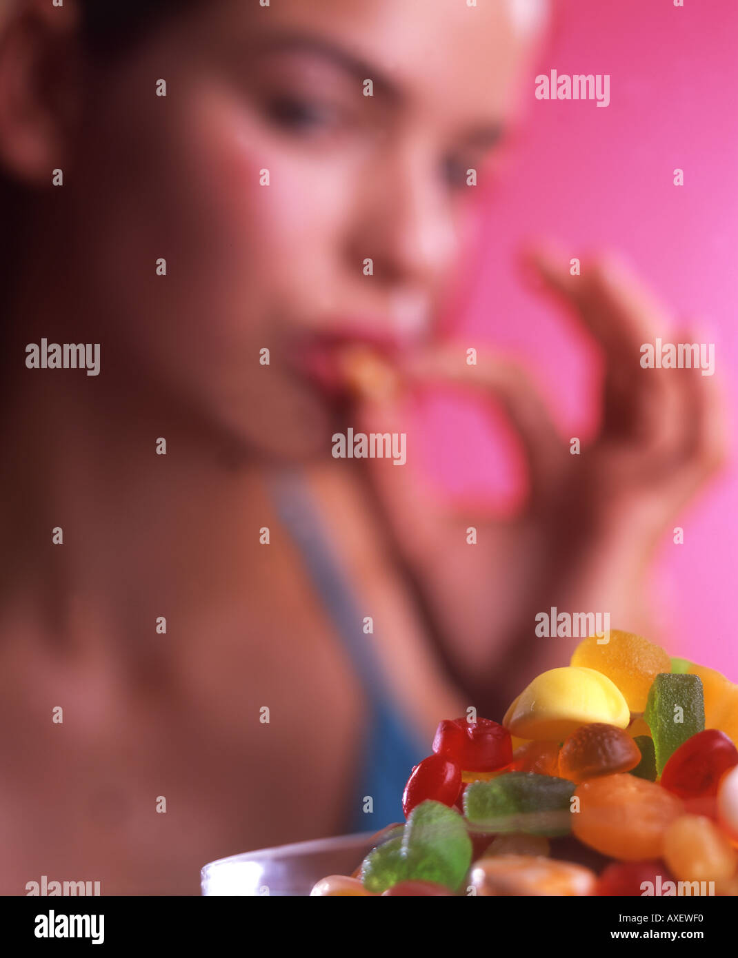 woman female girl young eat sweets sweet fruit drops drop indoor ...