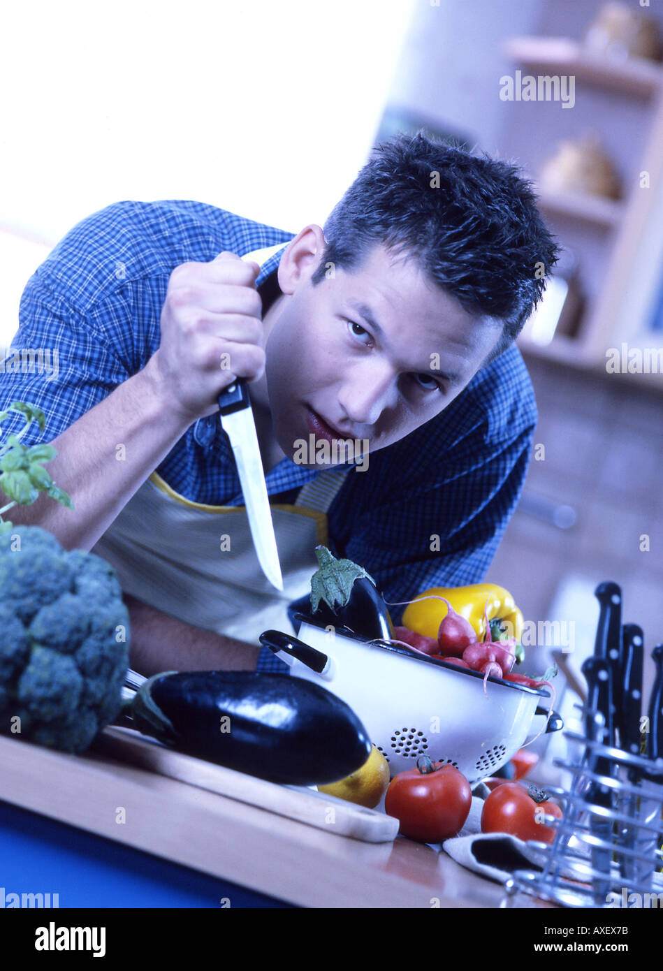 man male boy age 25 30 young cut knife vegetable vegetables fruit egg ...