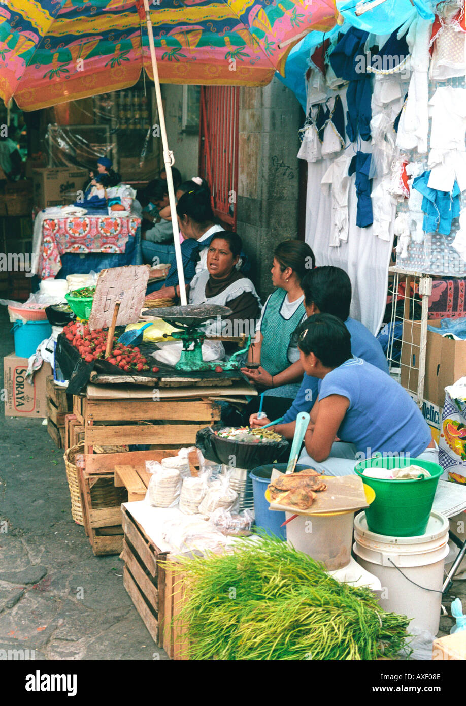 Mexican marketplace with sellers selling their wares Stock Photo - Alamy