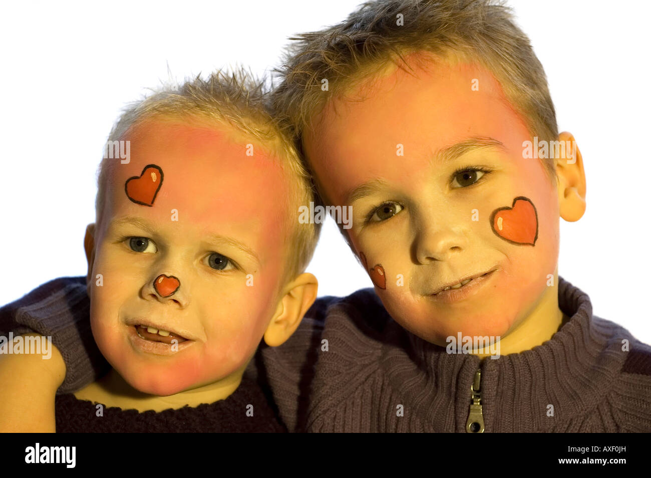Two lovely brothers with painted heart faces Use it for valentine ...