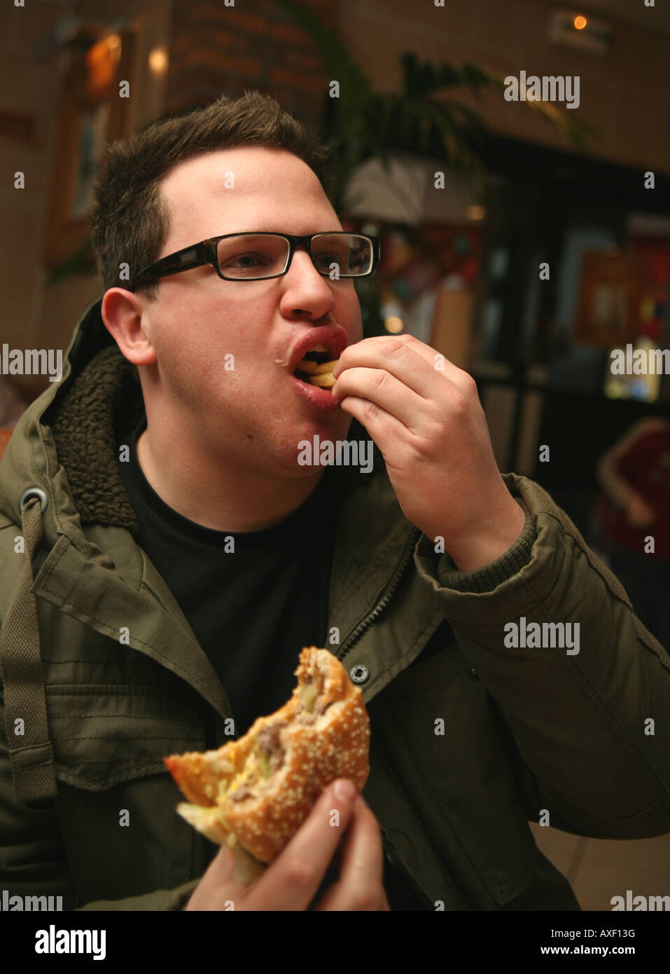 Man eating Burger Stock Photo - Alamy