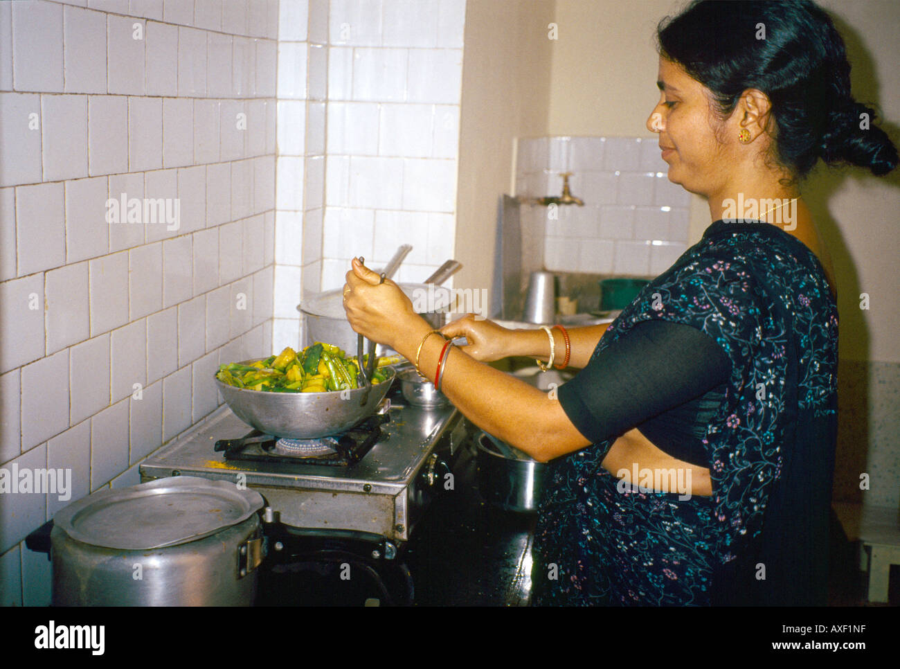 Calcutta India Cooking Vegetables In Kitchen Stock Photo - Alamy