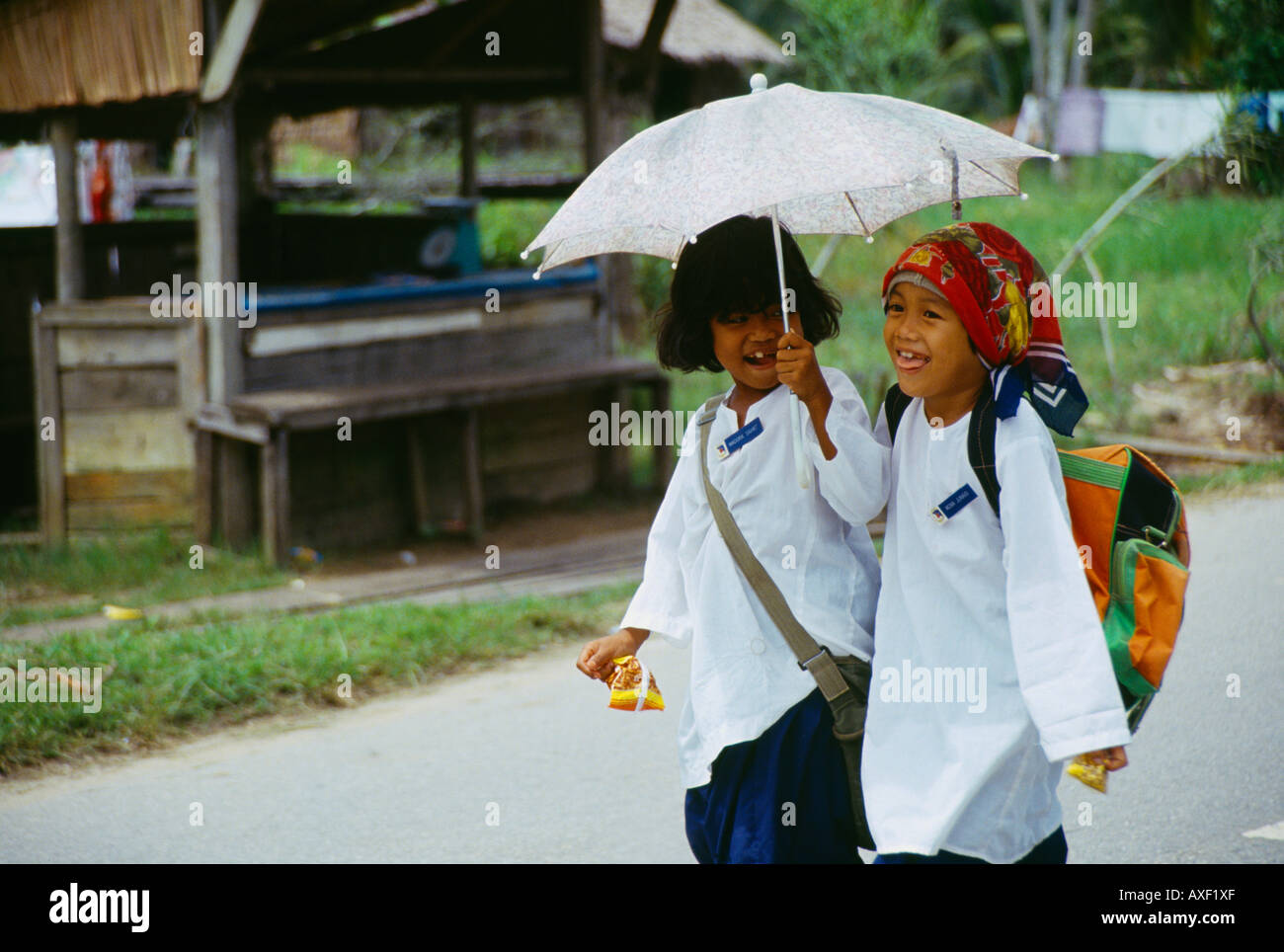 Sarawak Malaysia Children Coming Home From School Stock Photo - Alamy