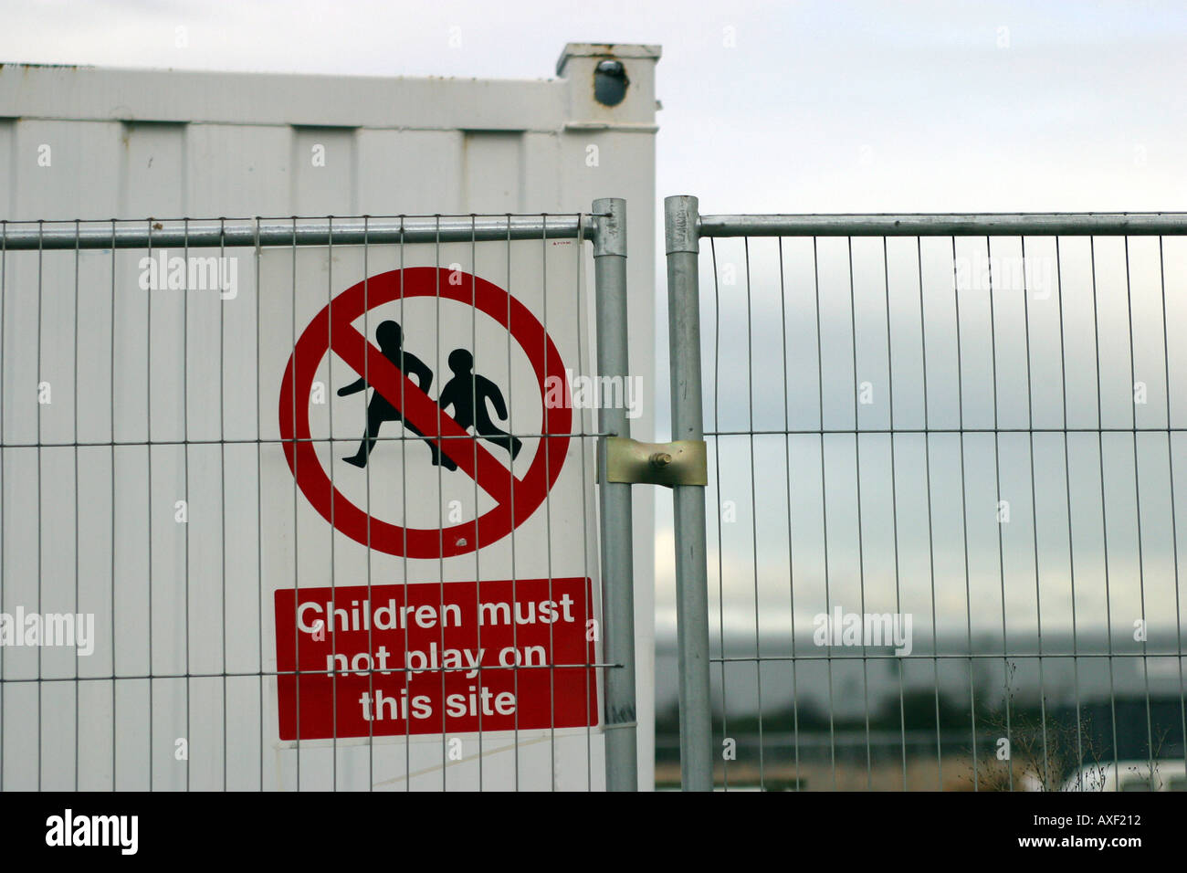 warning sign on the perimeter of a building site Stock Photo - Alamy