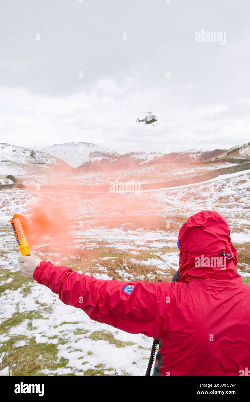 A smoke flare attracts an Air ambulance to a mountain rescue casualty ...