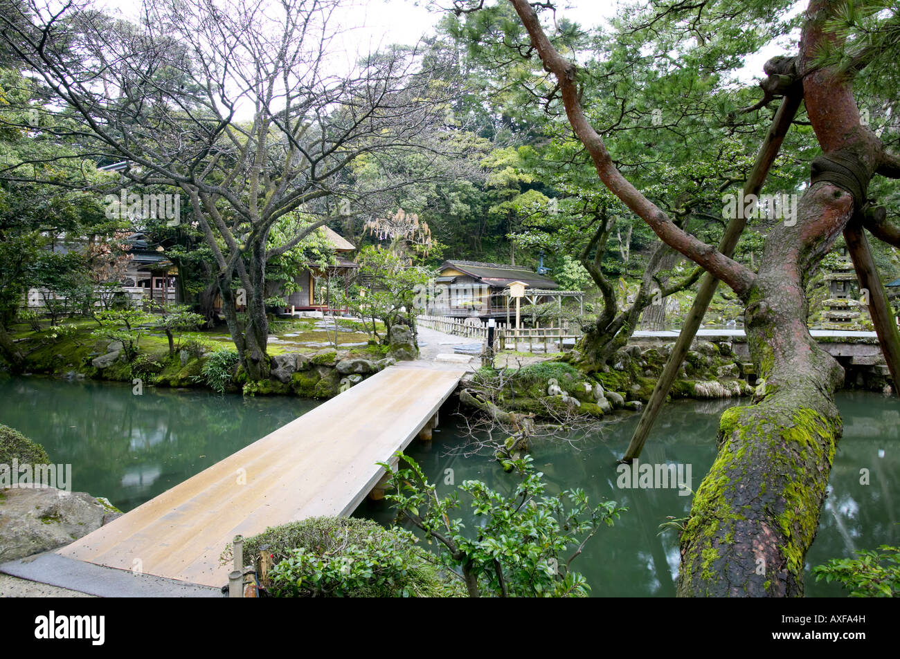 WOODEN BRIDGE, SPRING AT KENROKUEN GARDENS, KANAZAWA, JAPAN. WIDELY ...