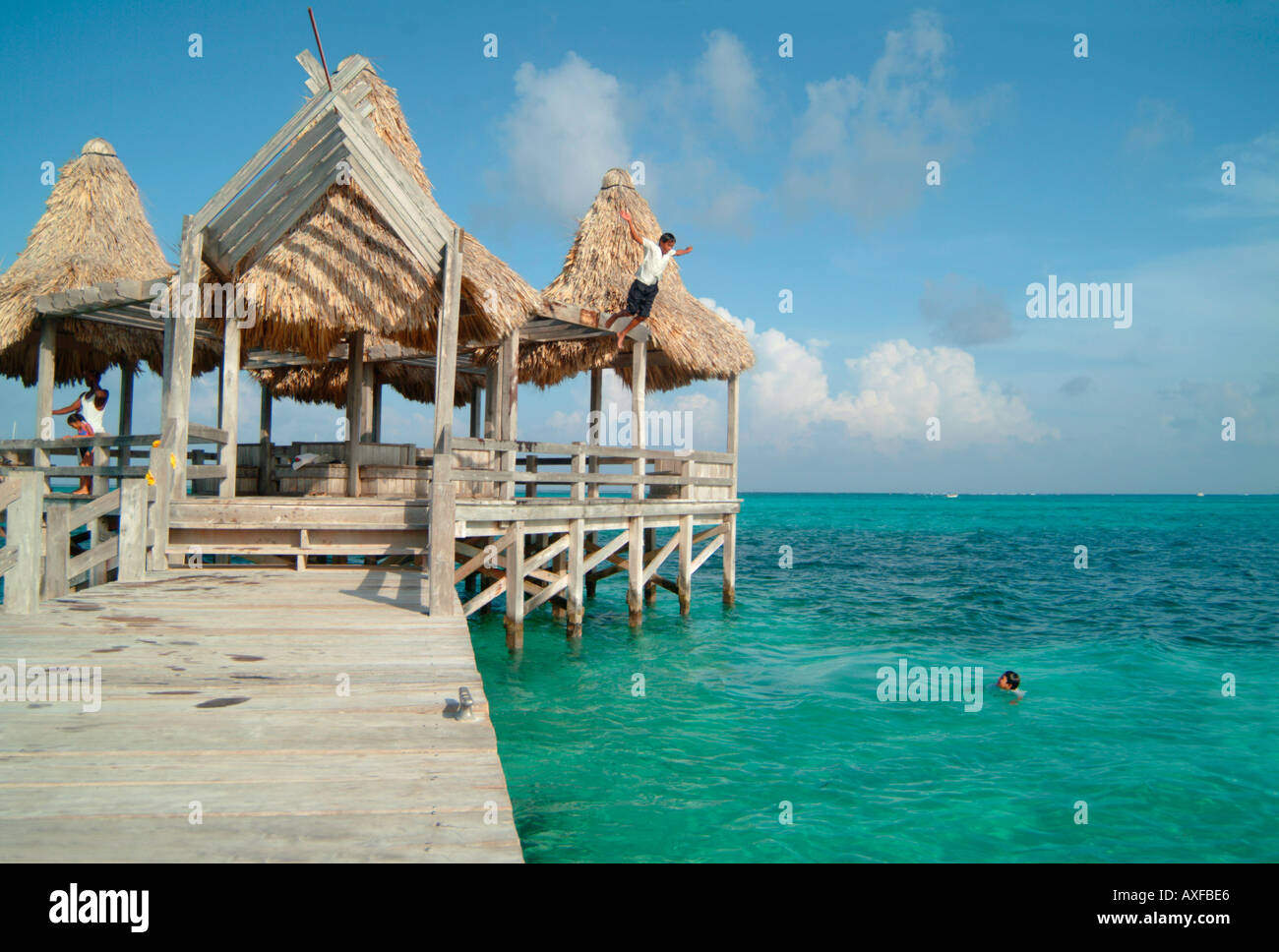 Kids jumping off dock hi-res stock photography and images - Alamy