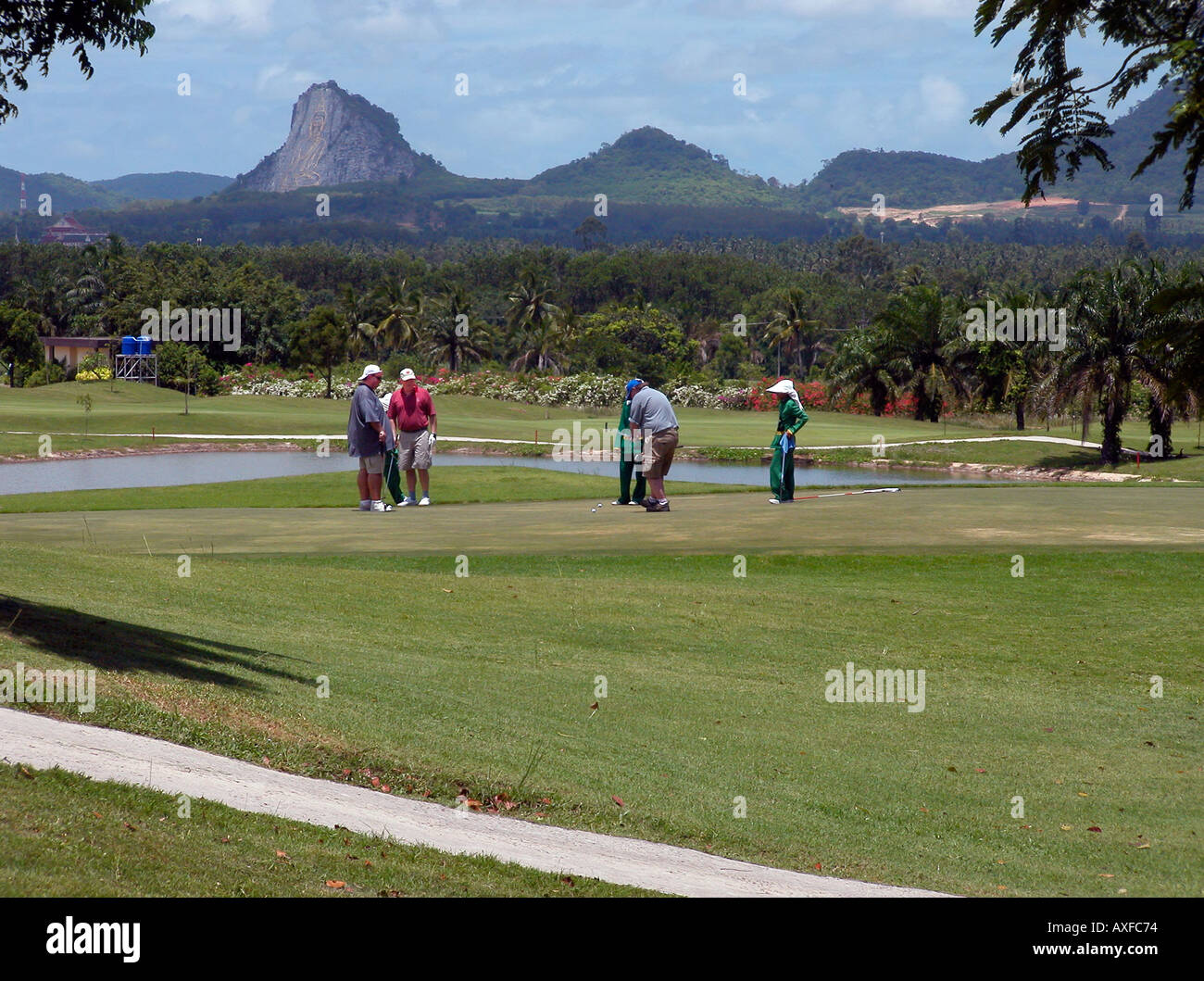 3 western men on the green with 2 female caddies Pheonix Golf and ...