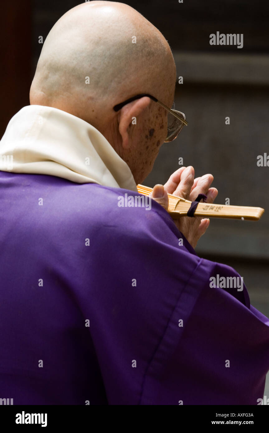 A man dressed in Heian period costume prays at the Gokusui no en ...