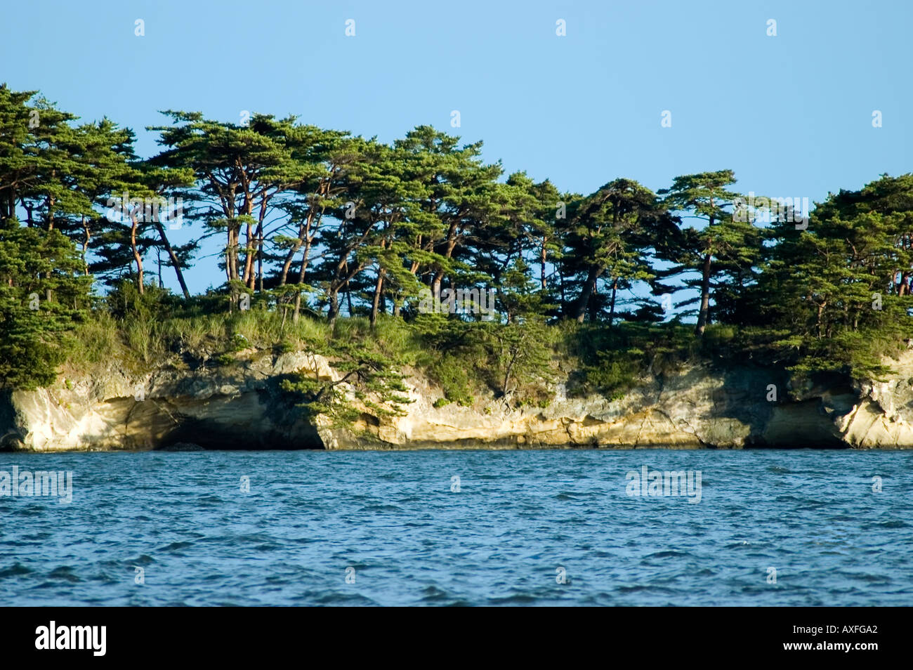 Calm seas lead up to one of Matsushima Bay s many small islands in ...