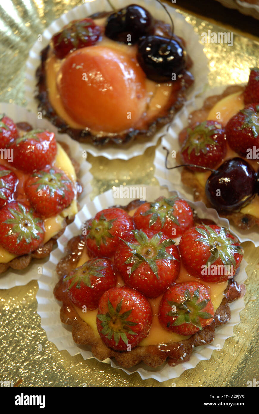 Strawberry and other flans in a shop Hampstead London Stock Photo - Alamy