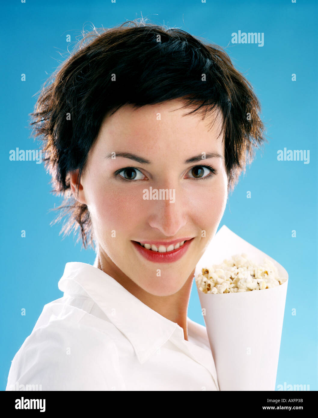 indoors studio woman girl young 20 25 brunette short hair hold eat ...