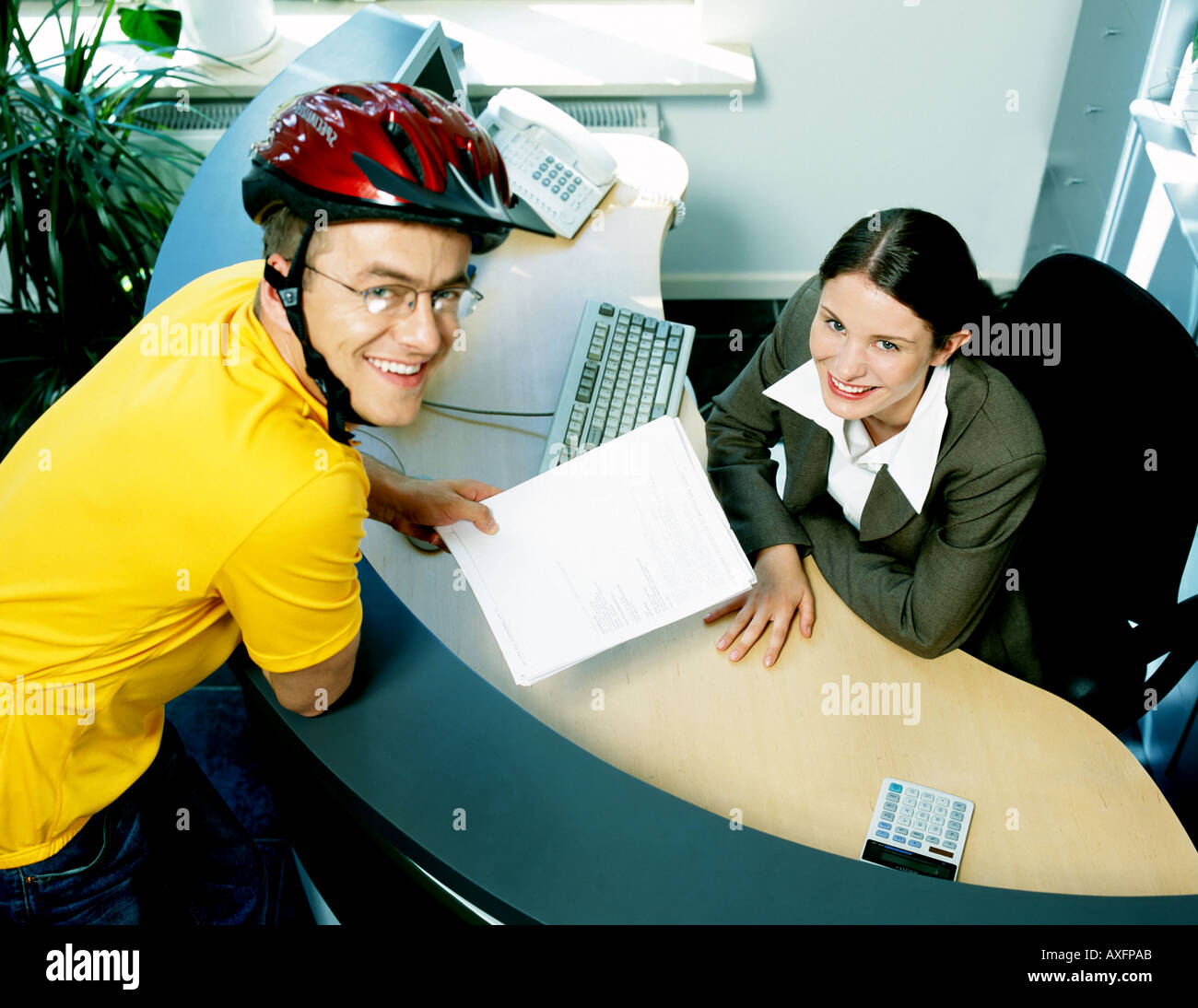 indoors office reception desk woman young girl 20 25 brunette secretary ...