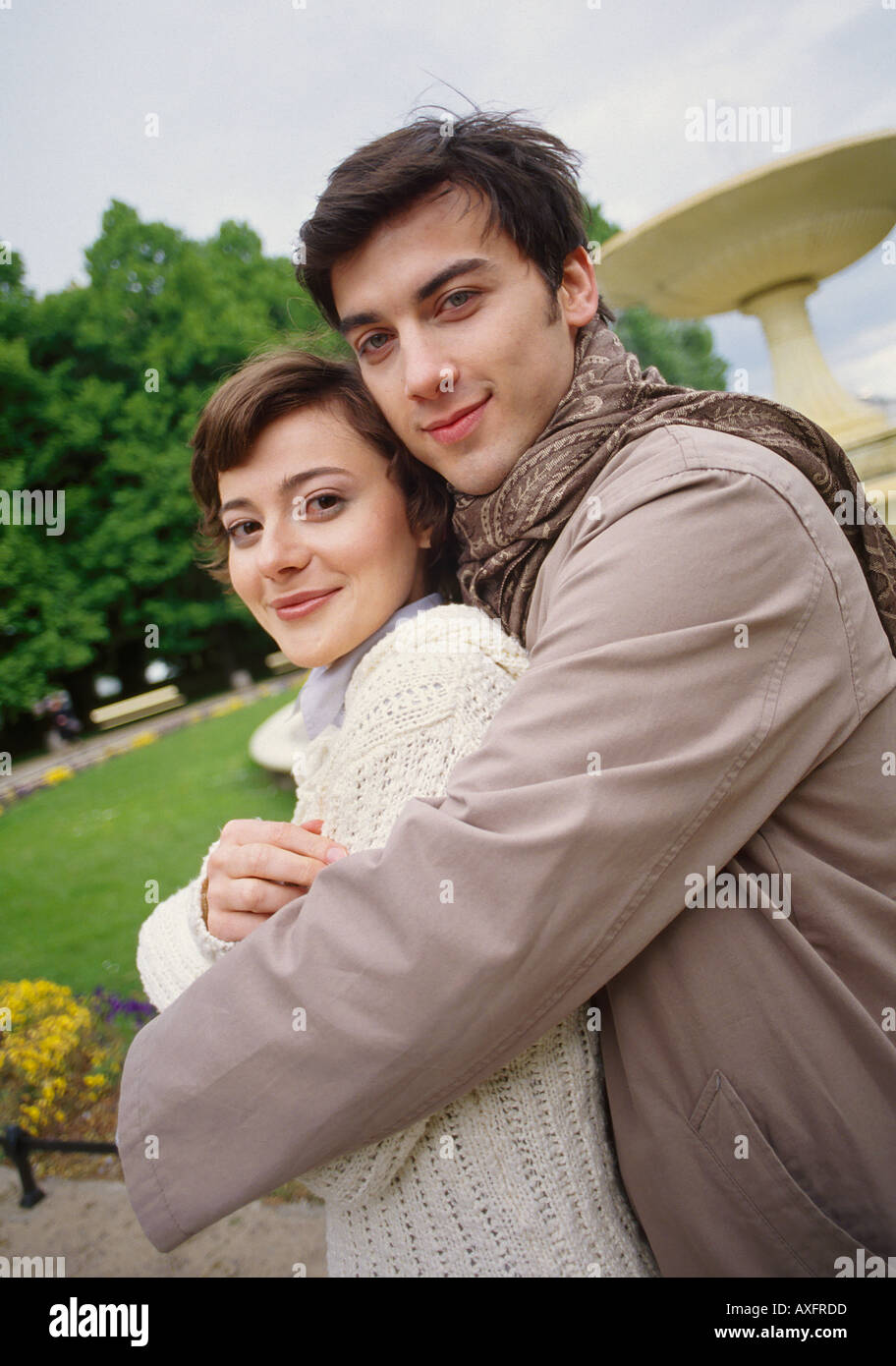 outdoors spring summer park fountain water couple woman young girl boy ...