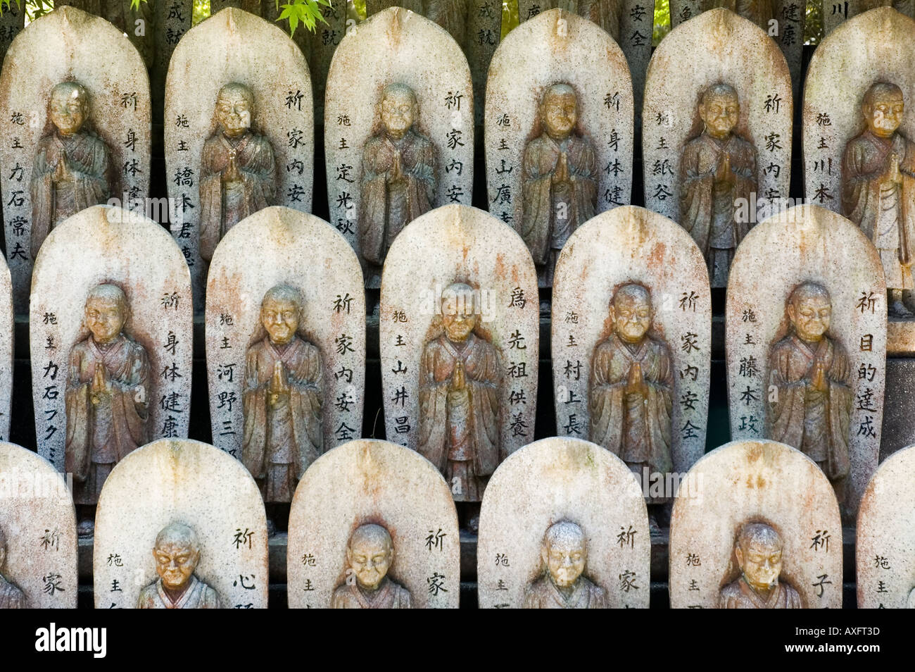 Statues stand peacefully at the Daisho in temple of Miyajima Japan ...