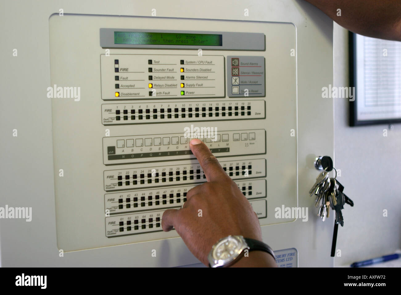 Operator Programming A Fire Alarm System Control Panel Stock Photo - Alamy