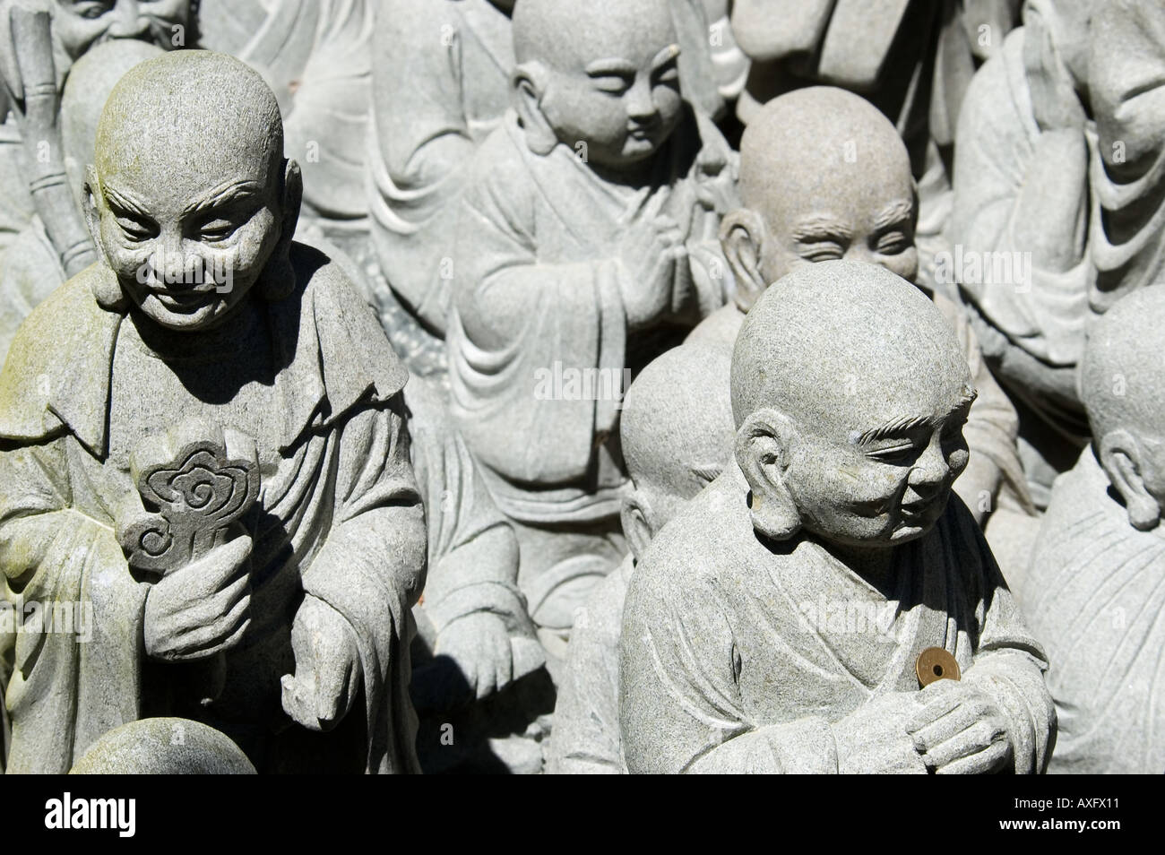 Statues stand peacefully at the Daisho in temple of Miyajima Japan ...