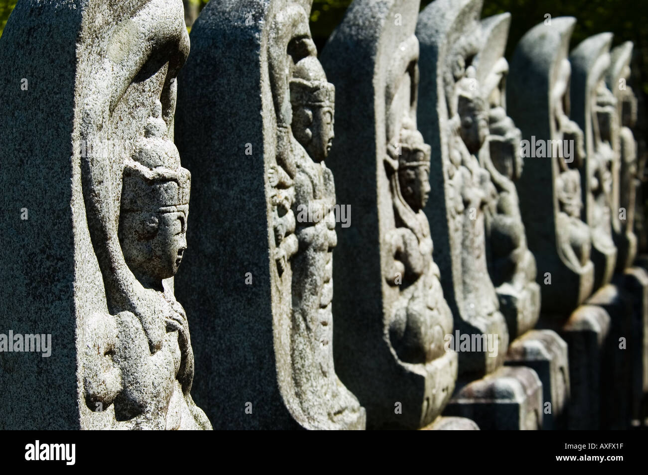 Statues stand peacefully at the Daisho in temple of Miyajima Japan ...