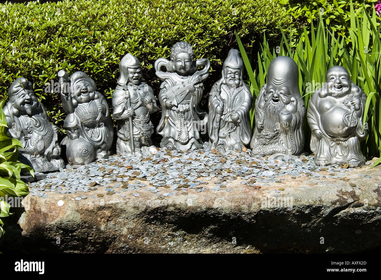 Statues stand peacefully at the Daisho in temple of Miyajima Japan ...