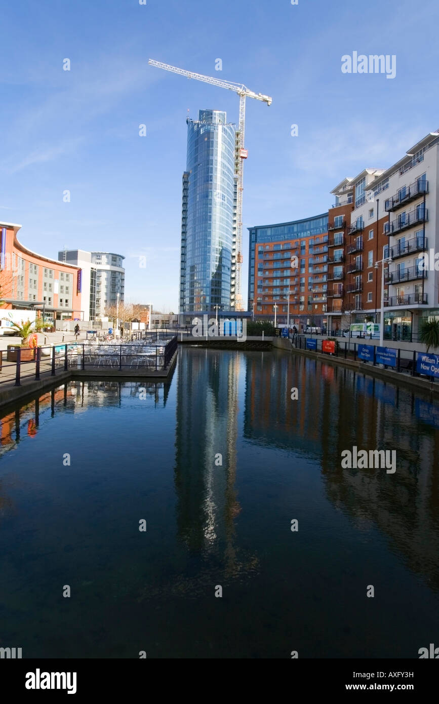 Reflection of tall building being built at Gunwharf Quays, Portmsouth ...
