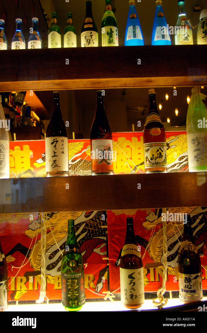 Window display in a Japanese Restaurant showing various bottles of Sake ...