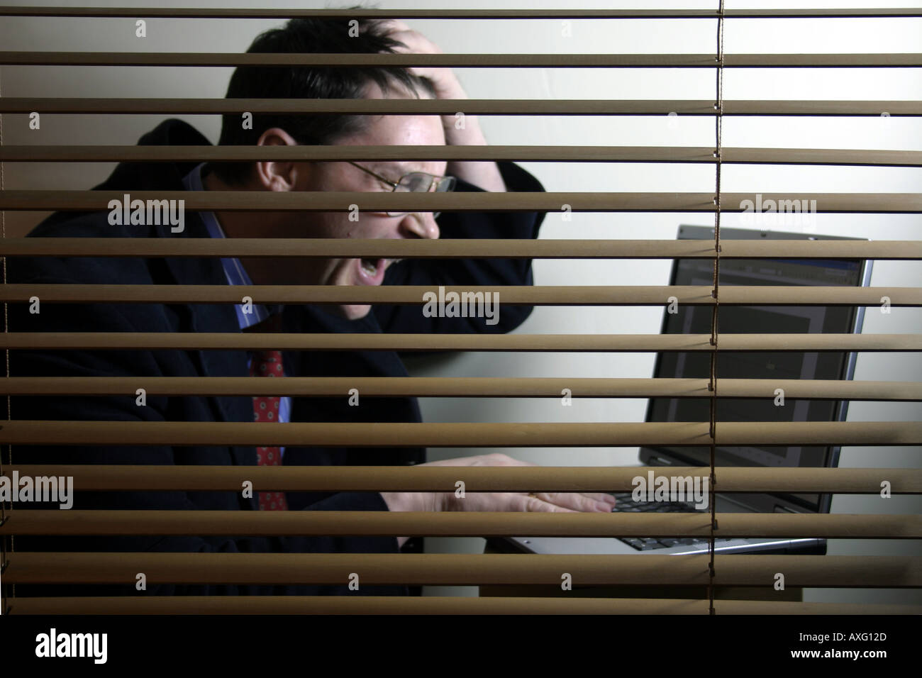 Angry man behind screen hi-res stock photography and images - Alamy