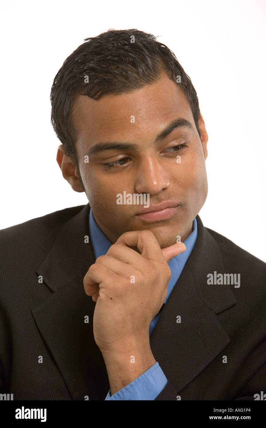 Thoughtful young man wearing a business suit Stock Photo - Alamy
