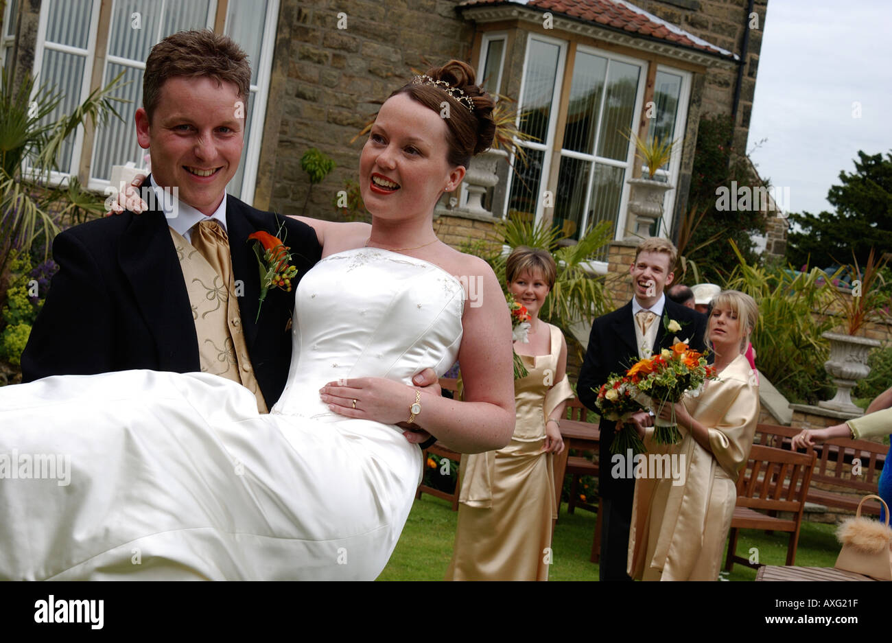 groom carrying bride on wedding day Stock Photo - Alamy