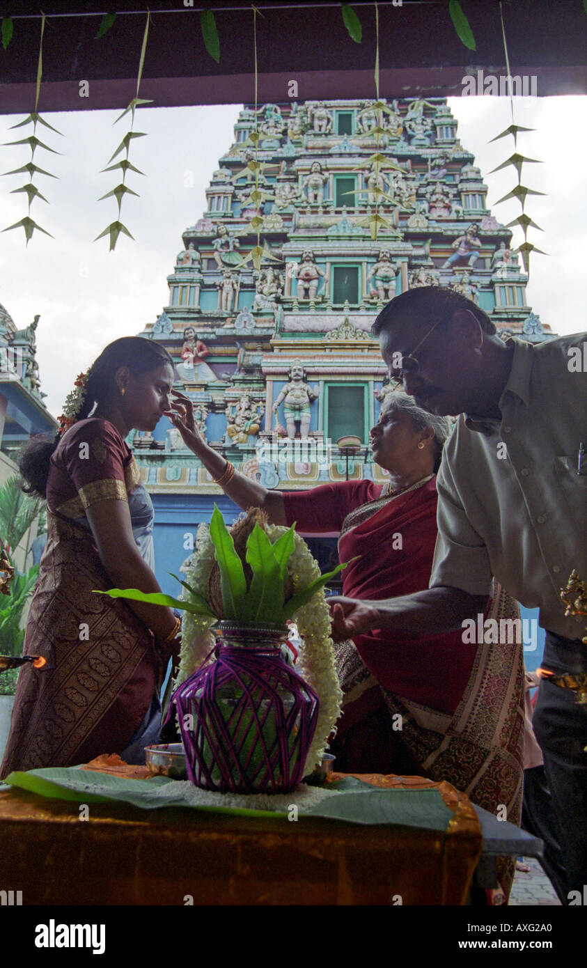 Devotees preparing for prayers on Deepavali at an Indian temple in ...