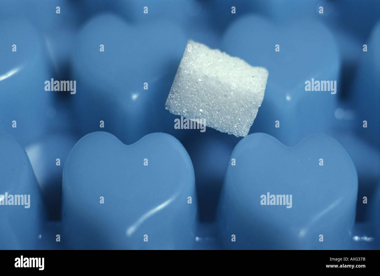 White Sugar Cube on light heart background Stock Photo - Alamy