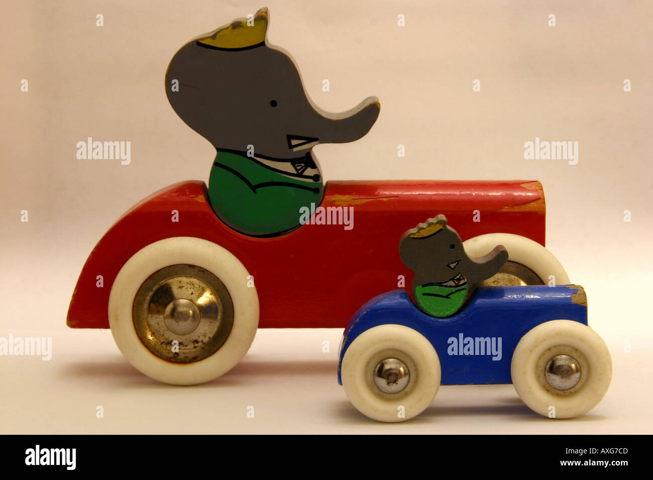 wooden toy cars depicting Babar the elephant Stock Photo - Alamy
