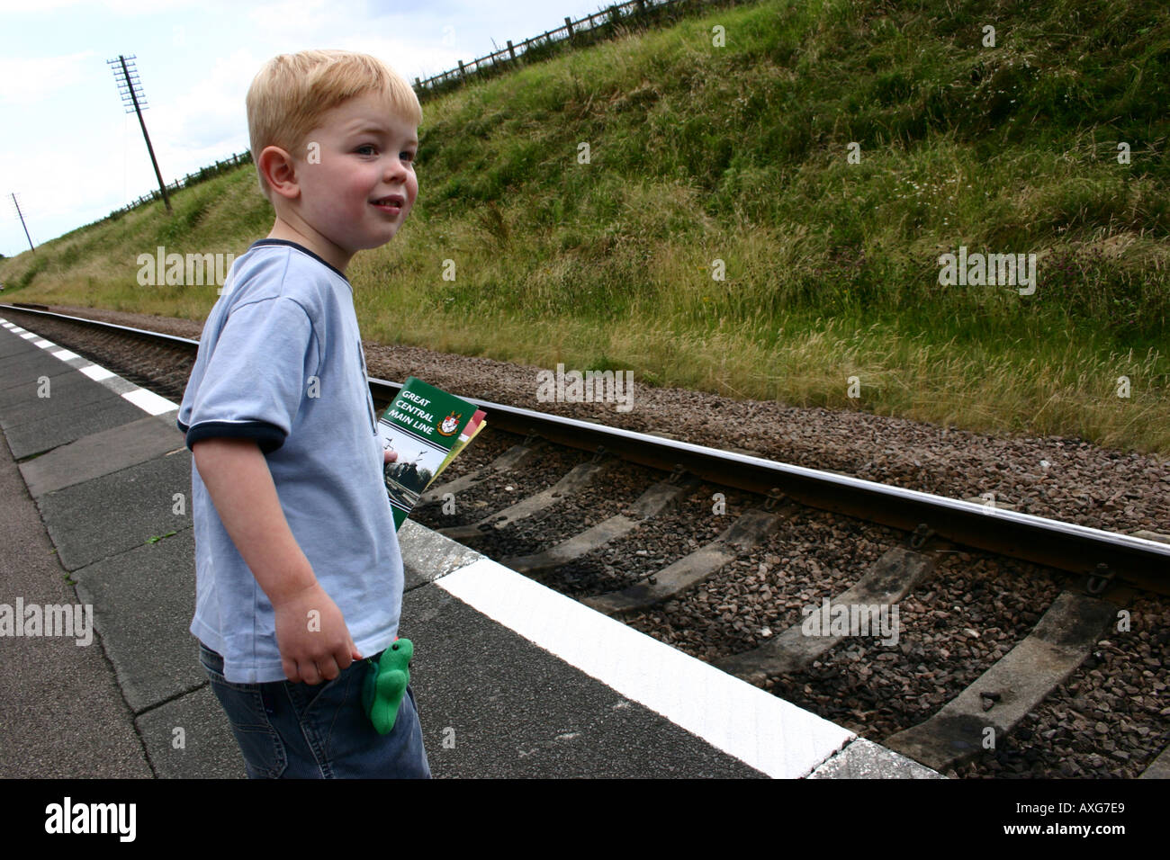Boy on train platform hi-res stock photography and images - Alamy