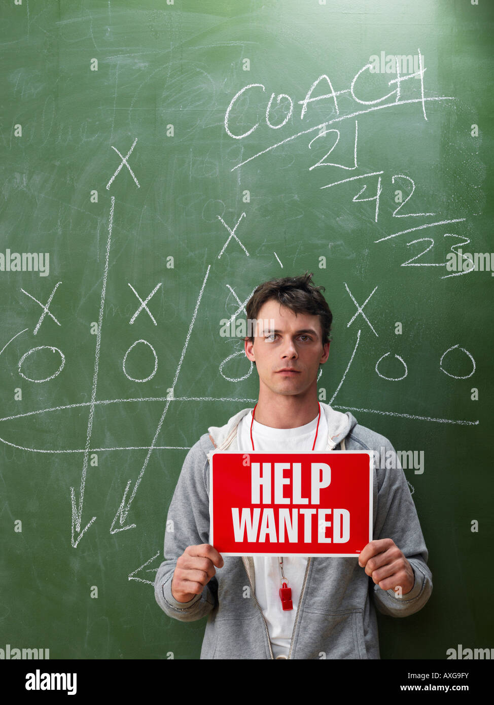 Coach Holding Help Wanted Sign Stock Photo - Alamy
