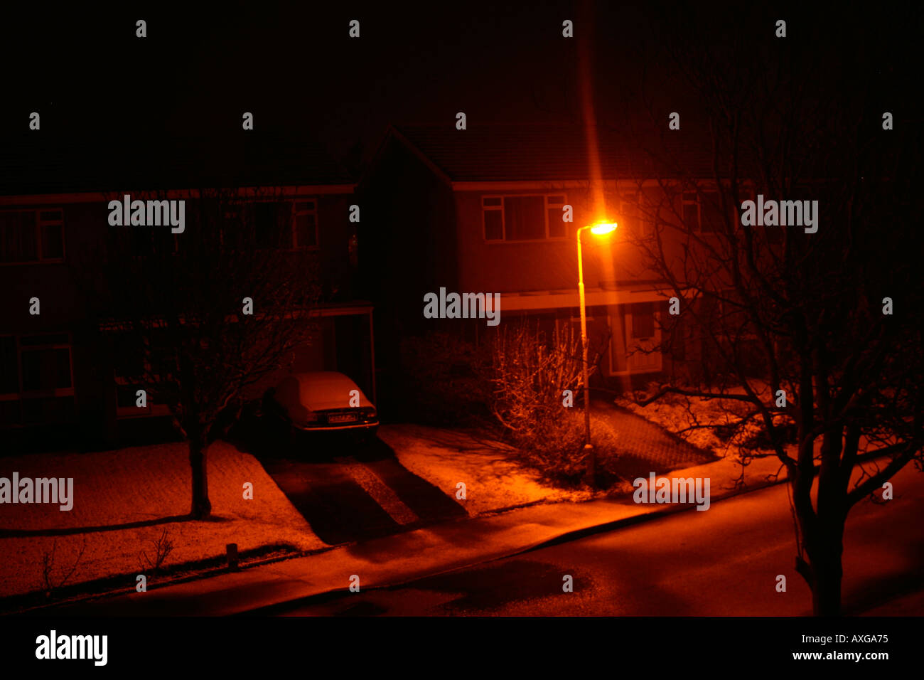Winter suburban street scene at night Stock Photo - Alamy