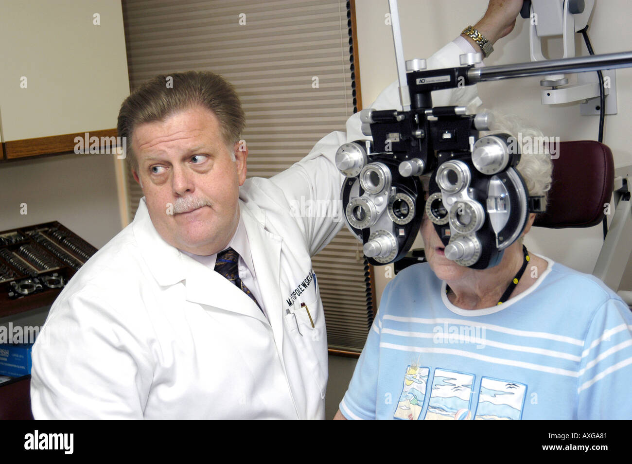 Senior female undergoes eye examination by an optometrist Stock Photo ...