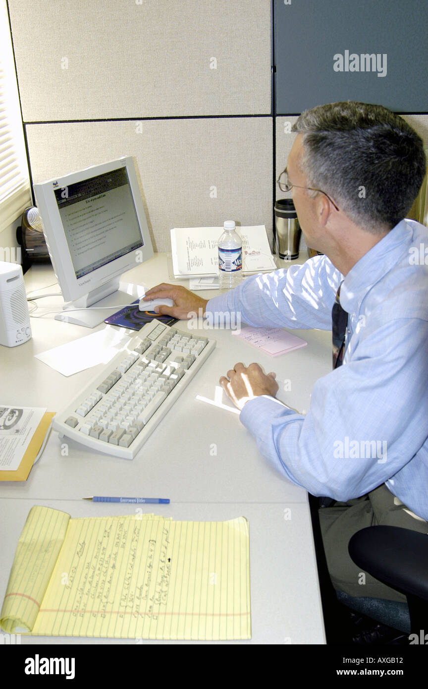 Professionals working at desk with latest technology shaking hands ...