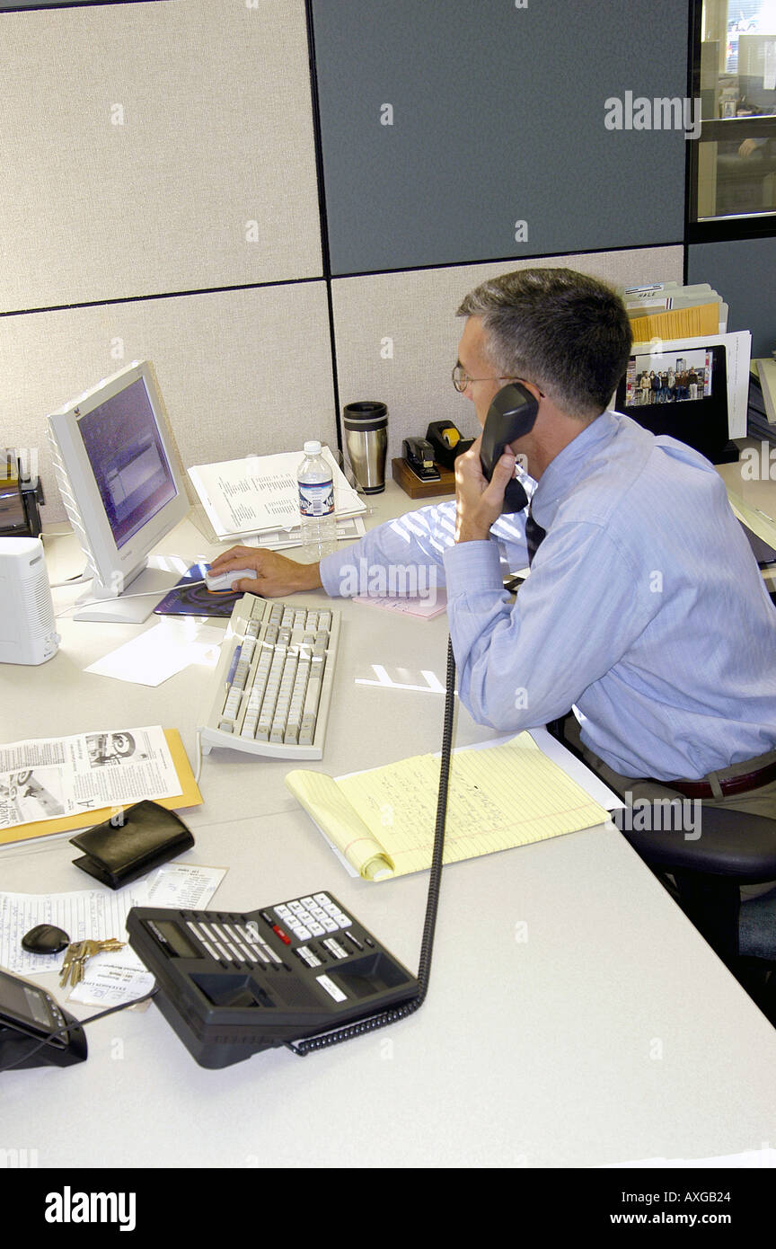 Professionals working at desk with latest technology shaking hands ...