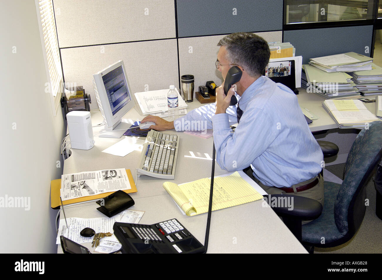Professionals working at desk with latest technology shaking hands ...