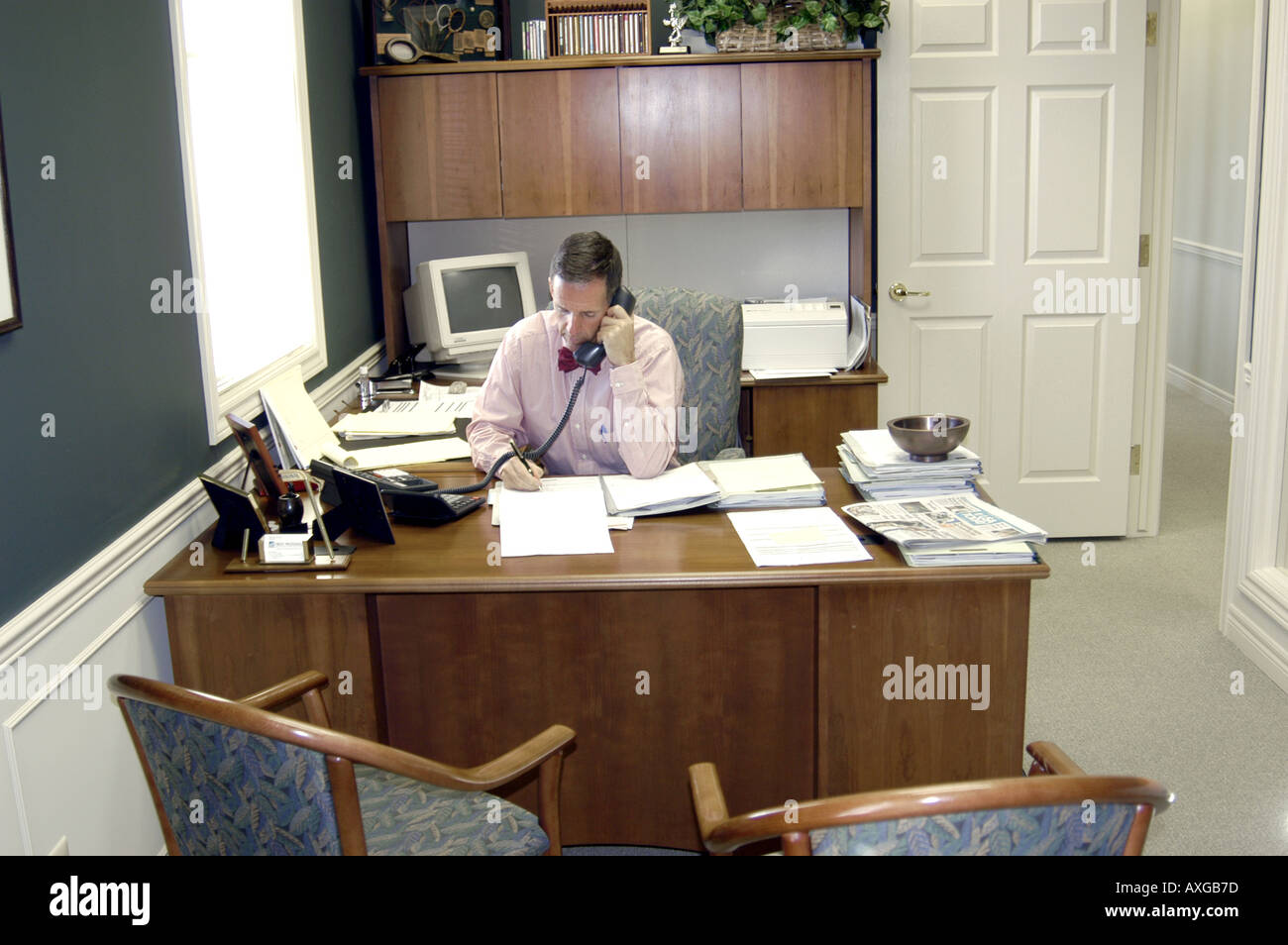Professionals working at desk with latest technology shaking hands ...
