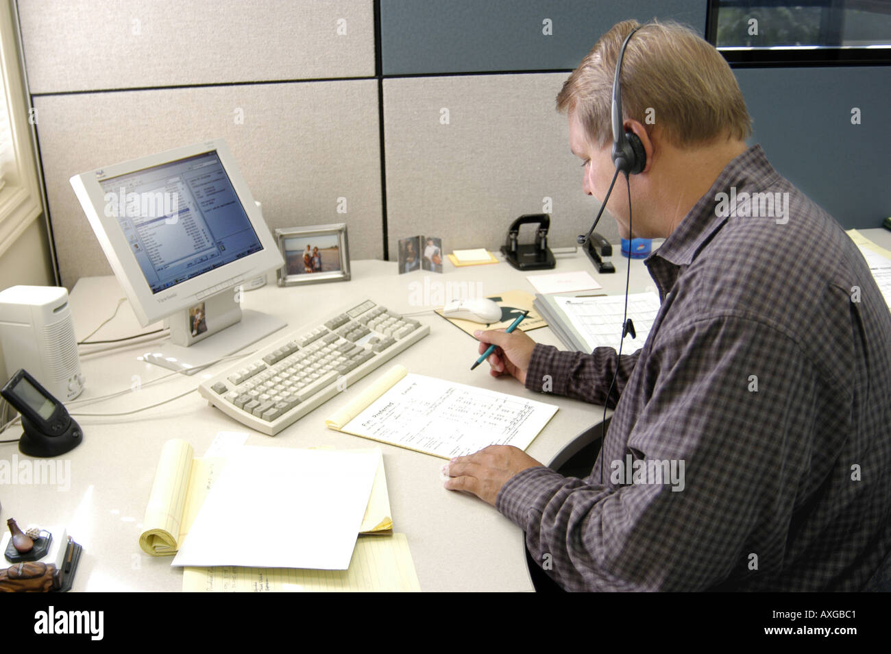 Professionals working at desk with latest technology shaking hands ...