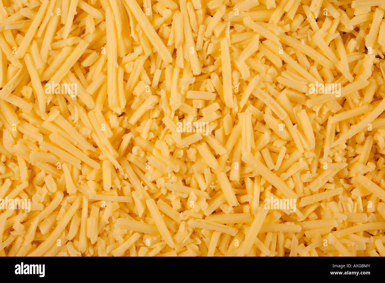 Full frame image of grated cheddar cheese Stock Photo - Alamy