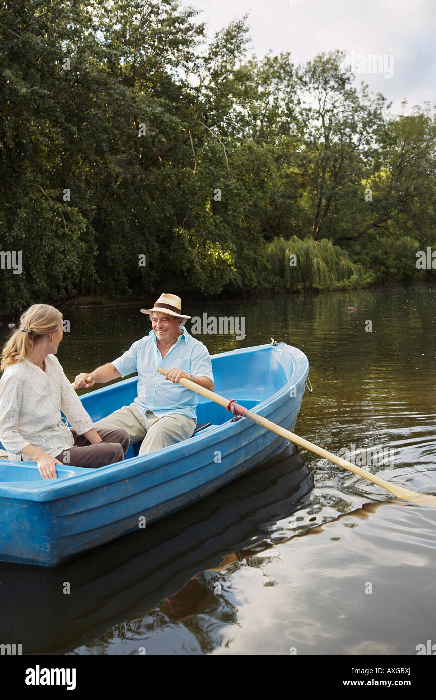 Couple in Rowboat Stock Photo - Alamy