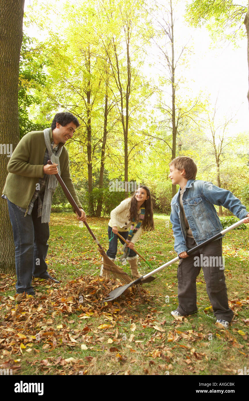Boy And Girl Rake Autumn Leaves High Resolution Stock Photography and ...