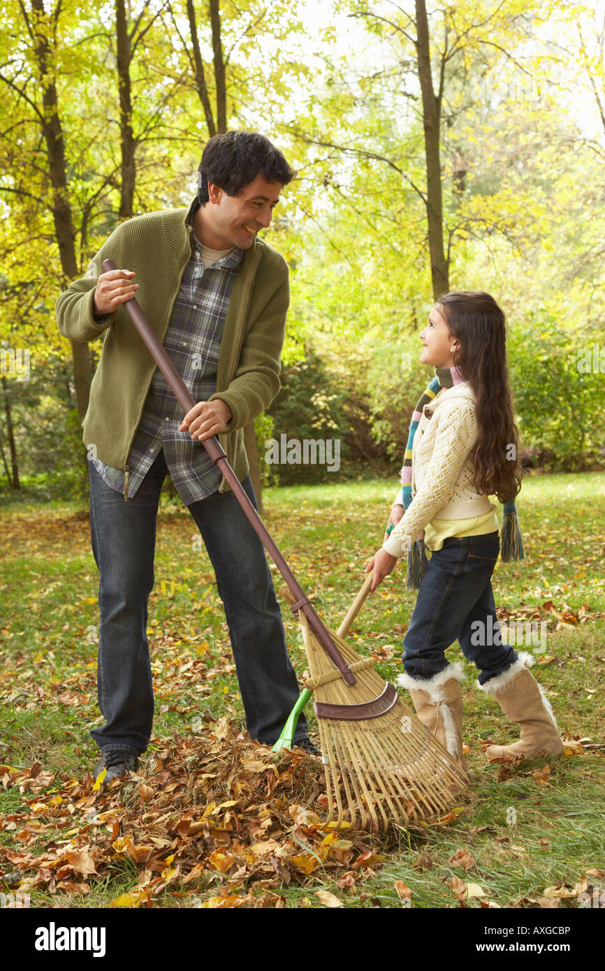 Child raking leaves hispanic hi-res stock photography and images - Alamy